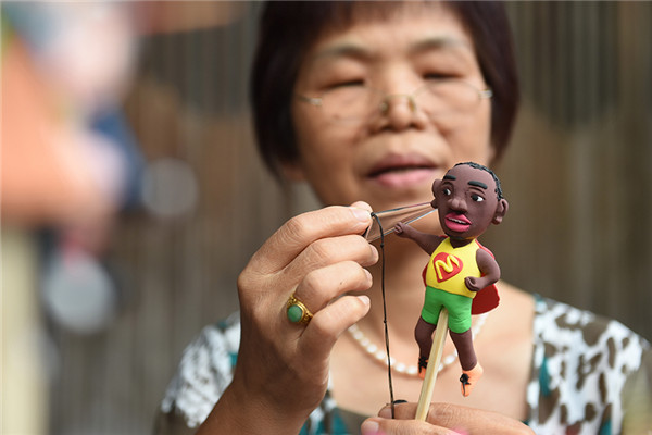 Dough Figurine Artists Make Tiny Olympic Stars